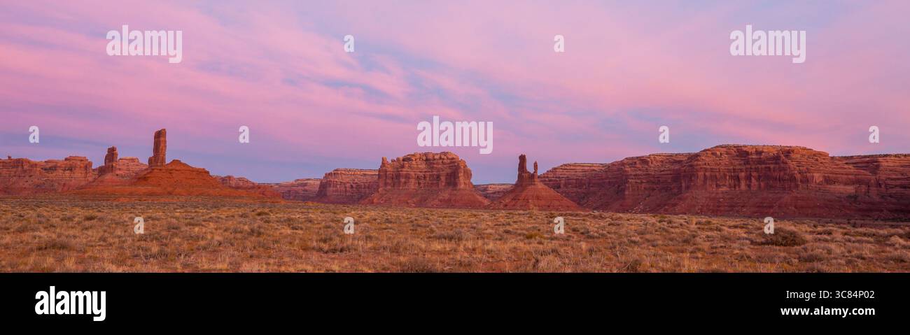 Valley of the Gods rock formation with Monument Valley at sunrise Stock ...
