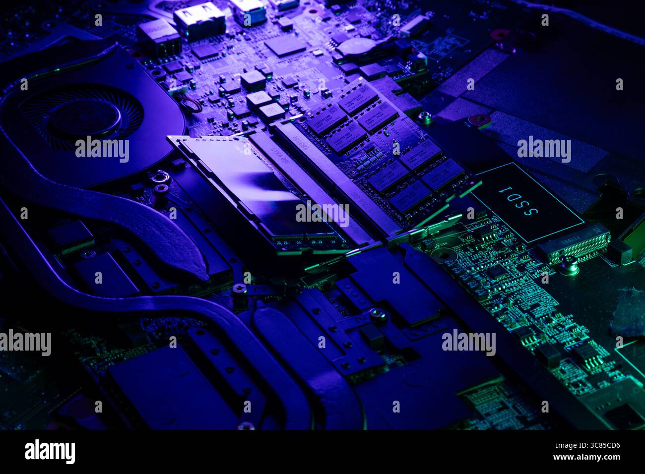 Macro Shot of Laptop RAM Modules and Cooling Fan on PCB with Blue and ...