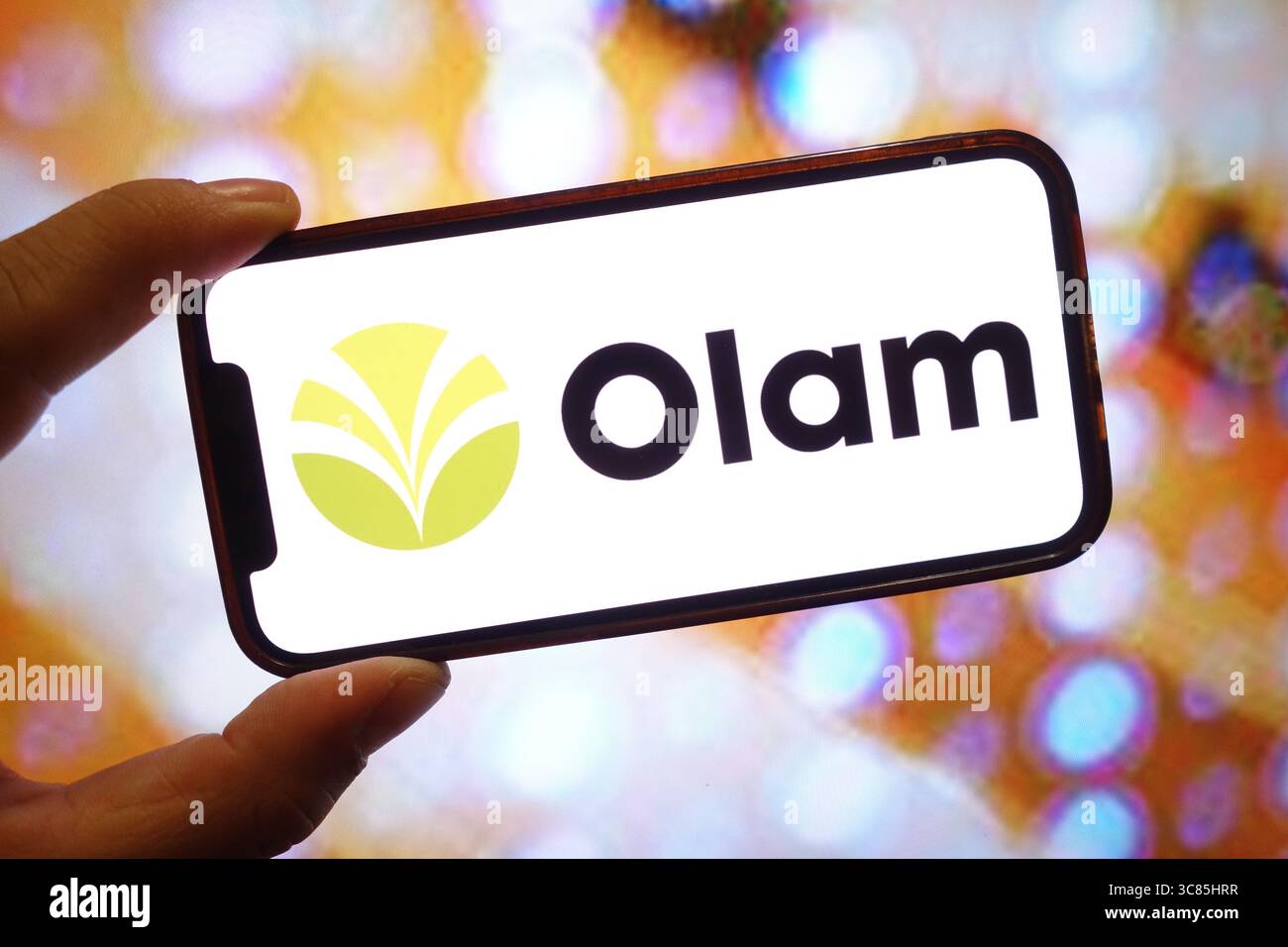 In this photo illustration, an Olam company logo is seen displayed on a ...