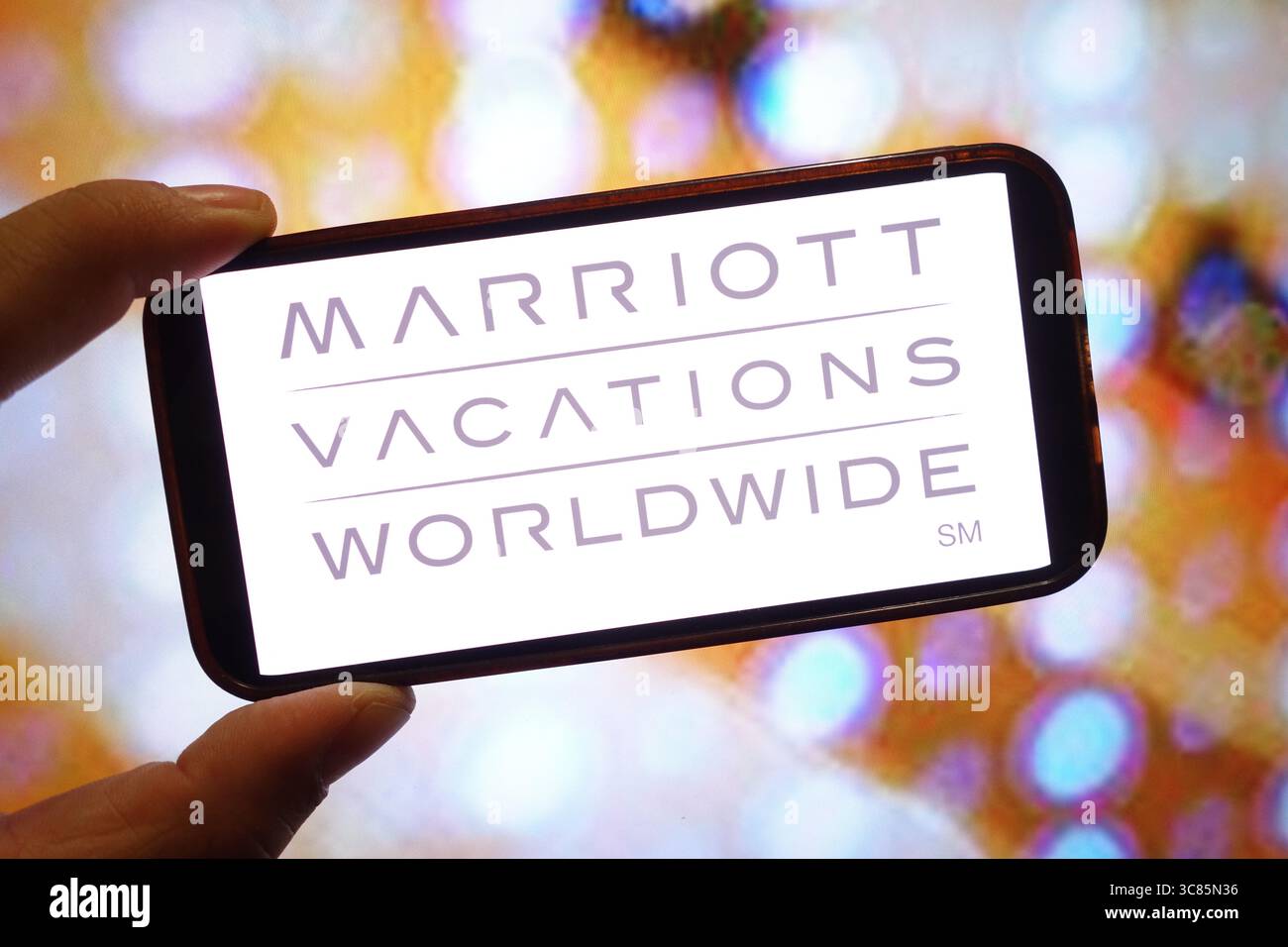In this photo illustration, a Marriott Vacations Worldwide company logo ...