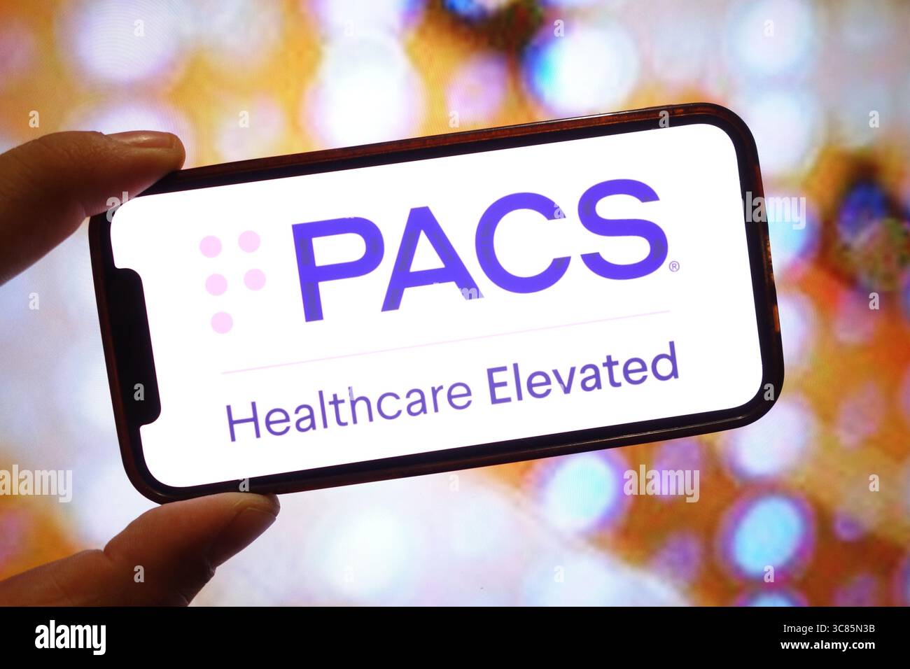 In this photo illustration, a PACS Group company logo is seen displayed ...