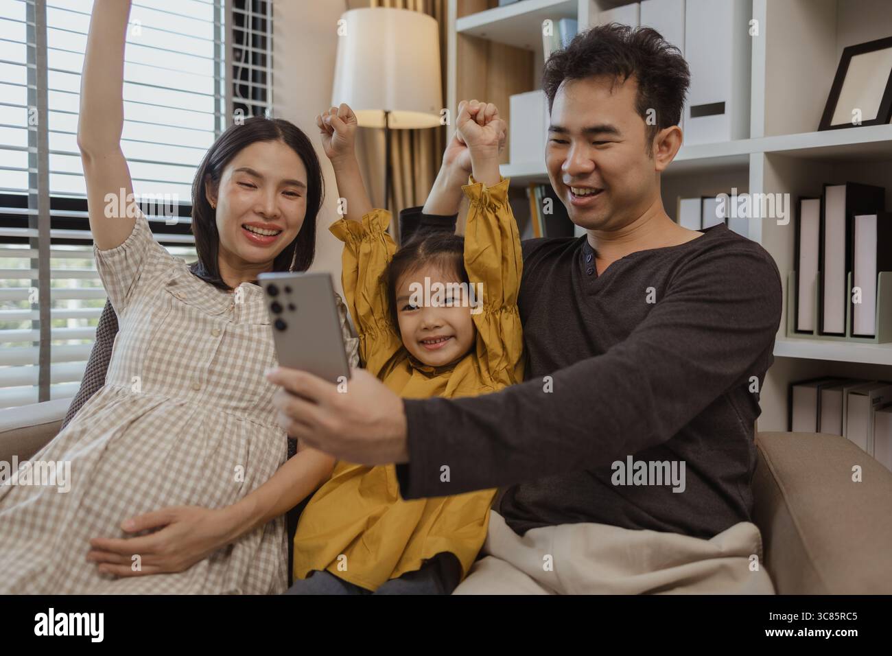 the happy family is excited to meet their new member soon as the mother ...