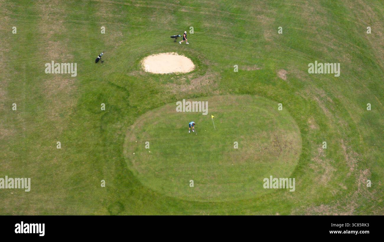 Golfers in Warwick play on green fairways after recent consistent rainfall. The west and east ...