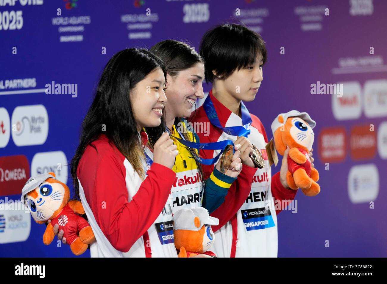 Gold medalist Meg Harris of Australia, center, flanked by silver ...