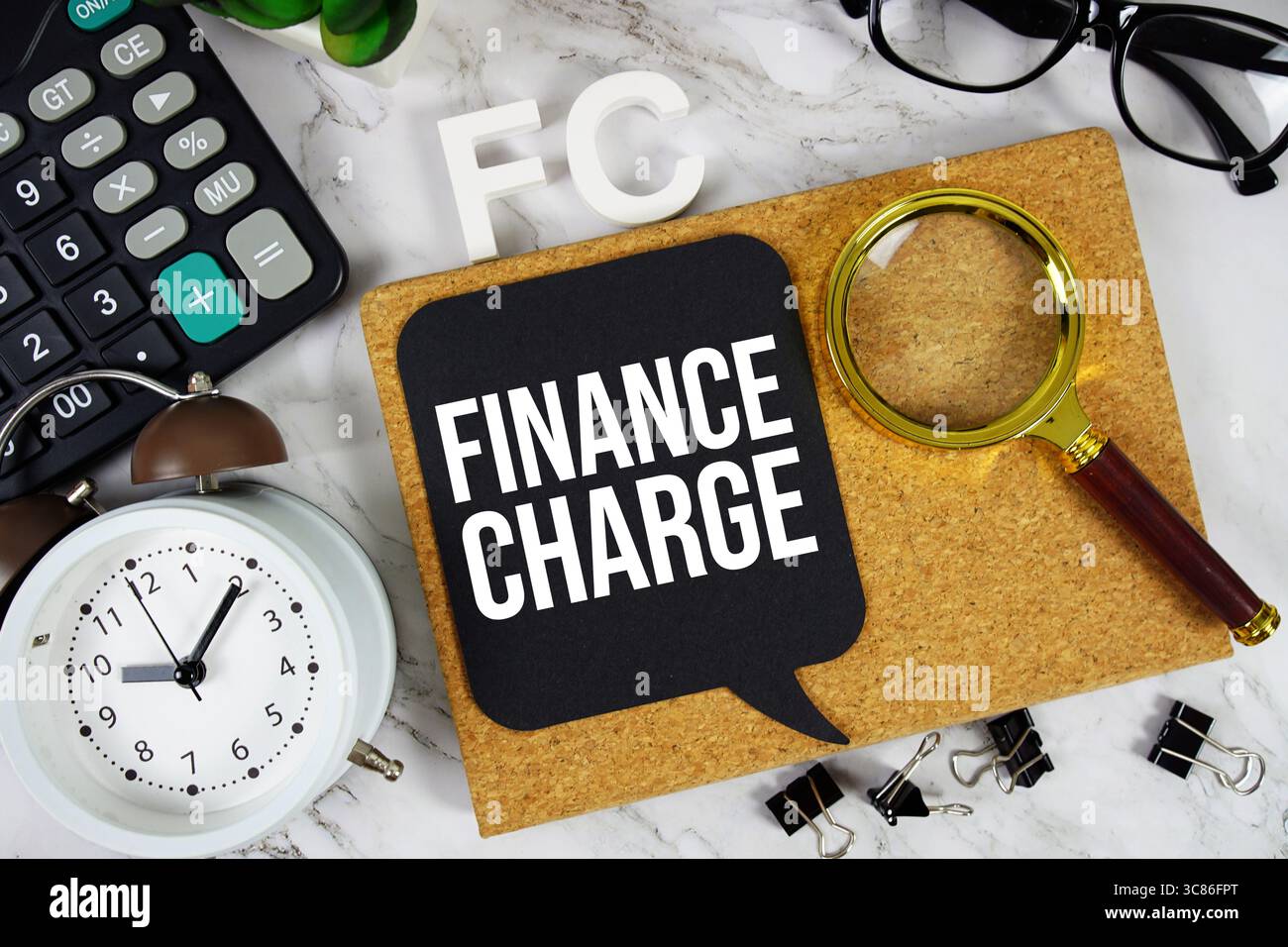FC - Finance Charge acronym with calculator, alarm clock and magnifying ...