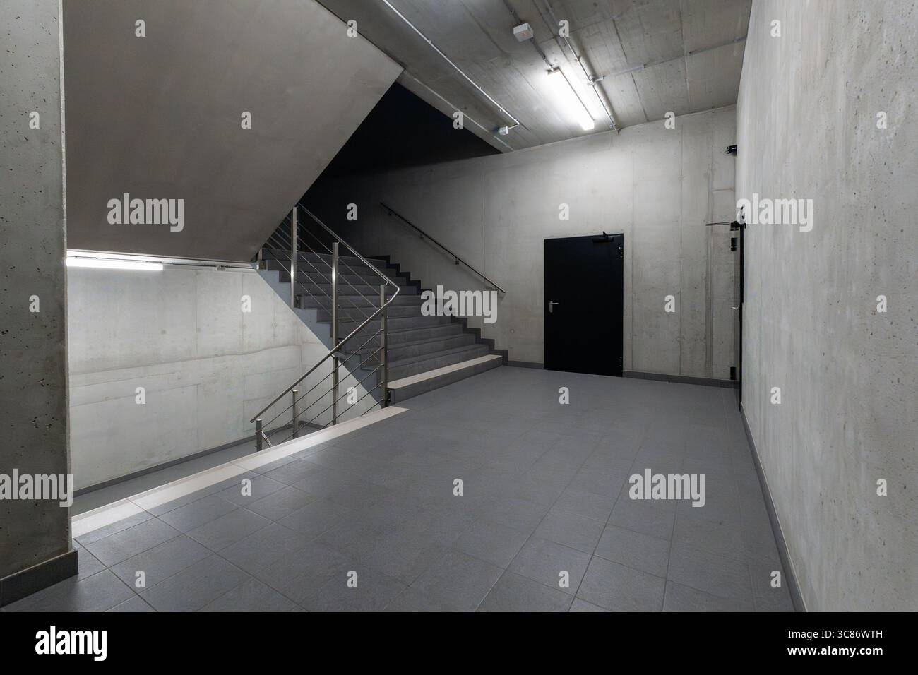 Minimalist industrial concrete stairwell architecture. Empty modern ...