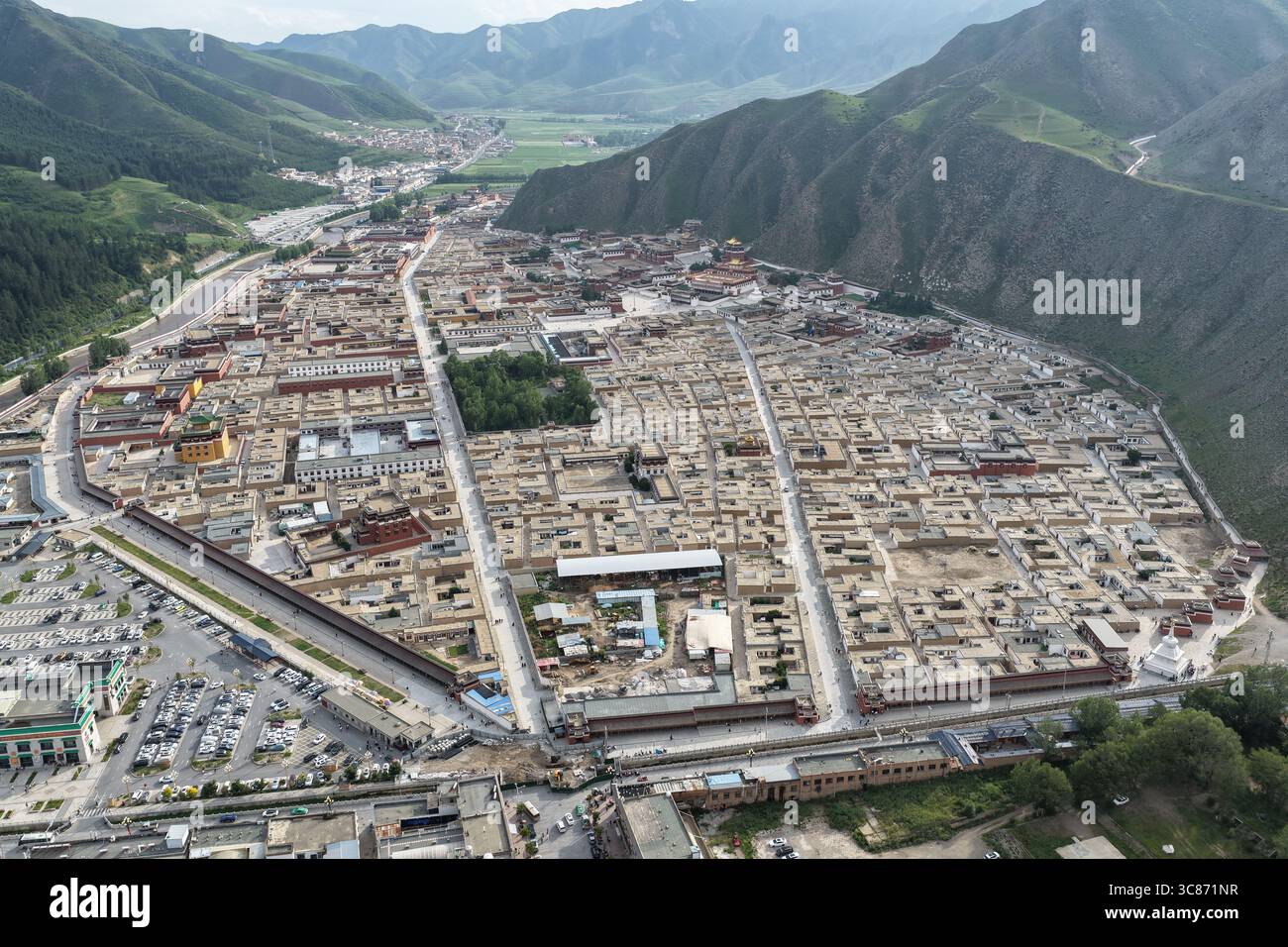 Aerial view of the Labrang Monastery nestled within the town, a ...