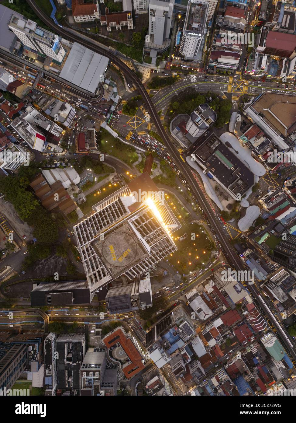 Aerial view of the iconic helipad atop a Kuala Lumpur building, bathed ...