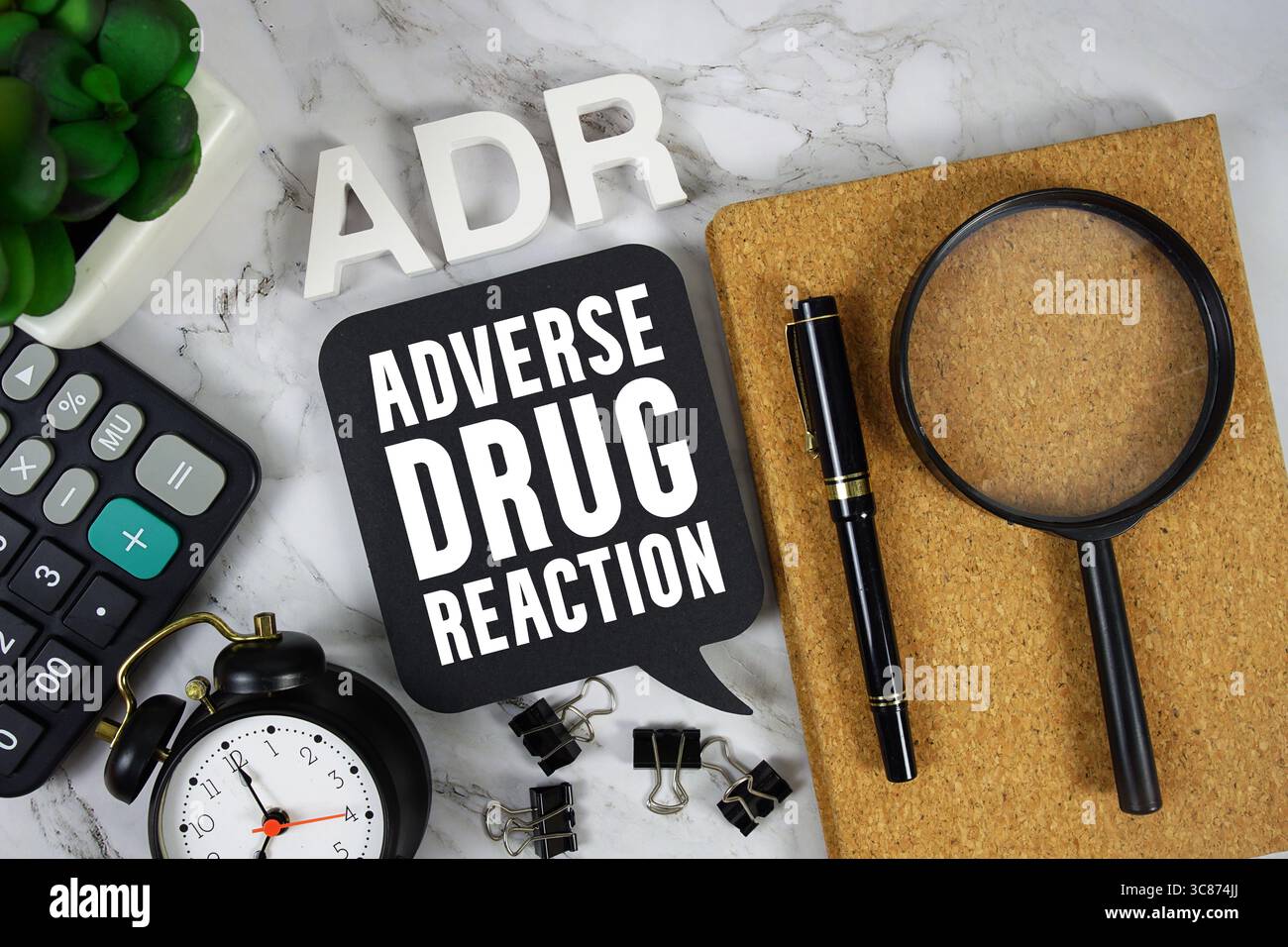 ADR Adverse Drug Reaction text with Calculator, alarm clock and ...