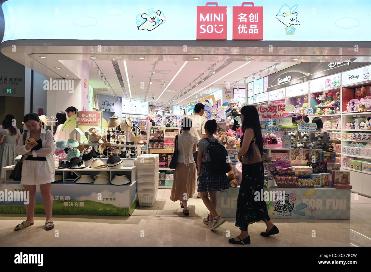 Shenzhen MINISO shop A general view showing people visit the MINISO ...