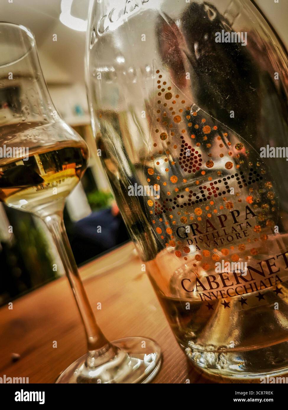 Glas of Grappa at a Party Stock Photo - Alamy