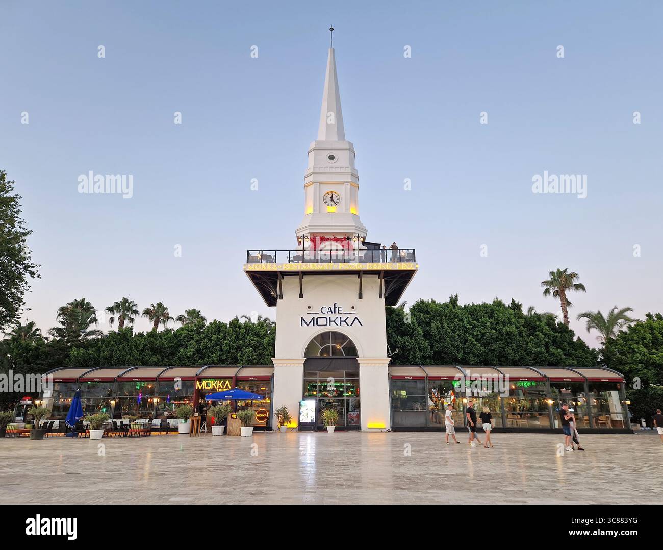 KEMER, TURKEY - JULY 1, 2025 Kemer Saat Kulesi today Cafe Mokka in the ...