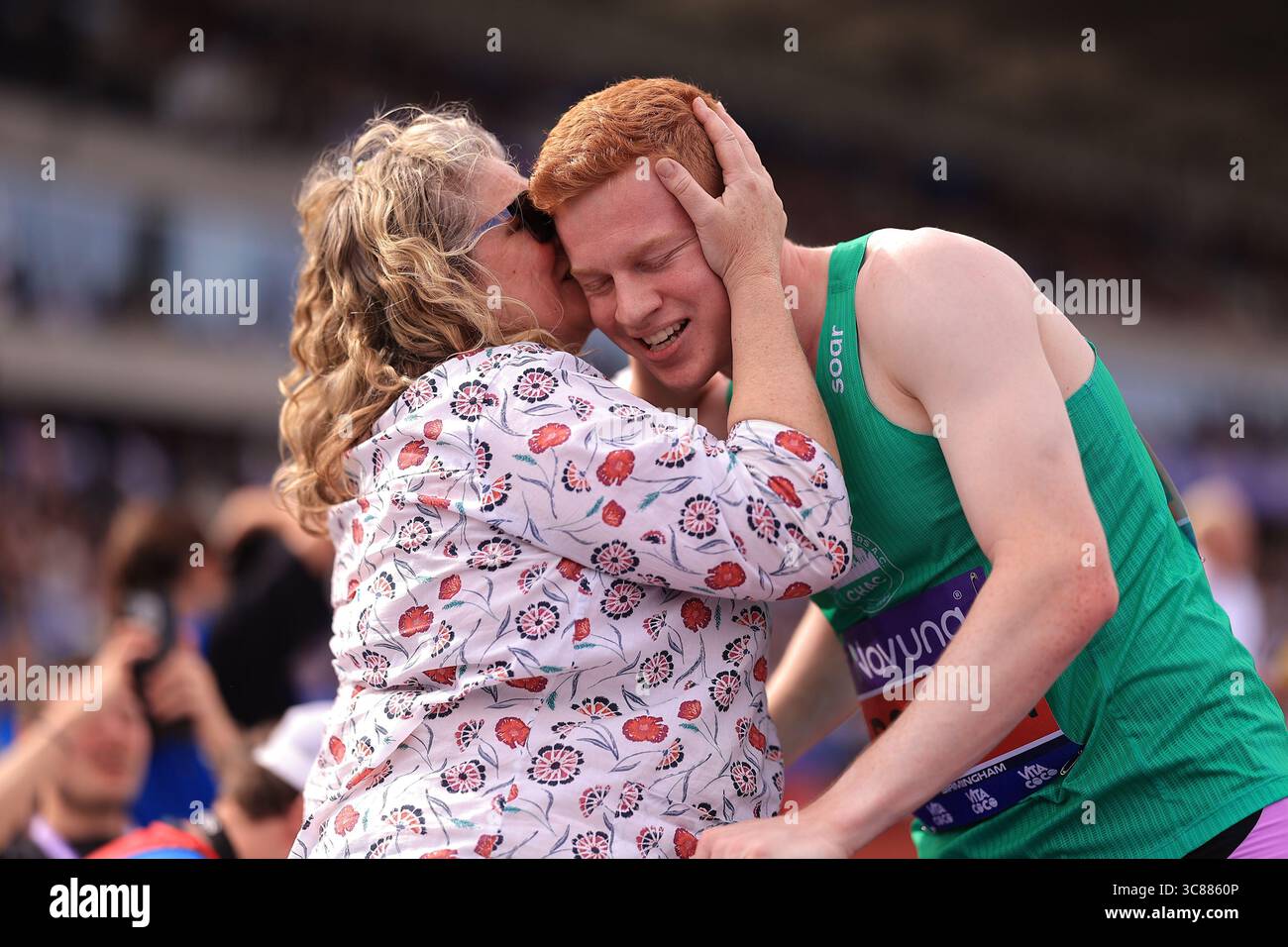 Charlie Dobson gets a kiss and a hug after winning the Mens' 400m ...