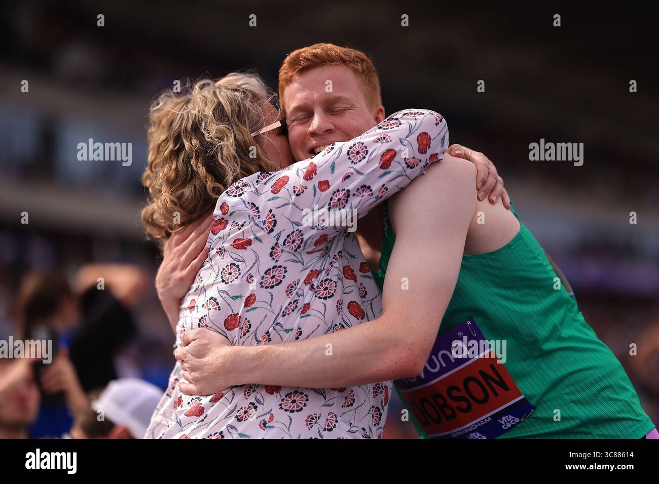 Charlie Dobson gets a kiss and a hug after winning the Mens' 400m ...