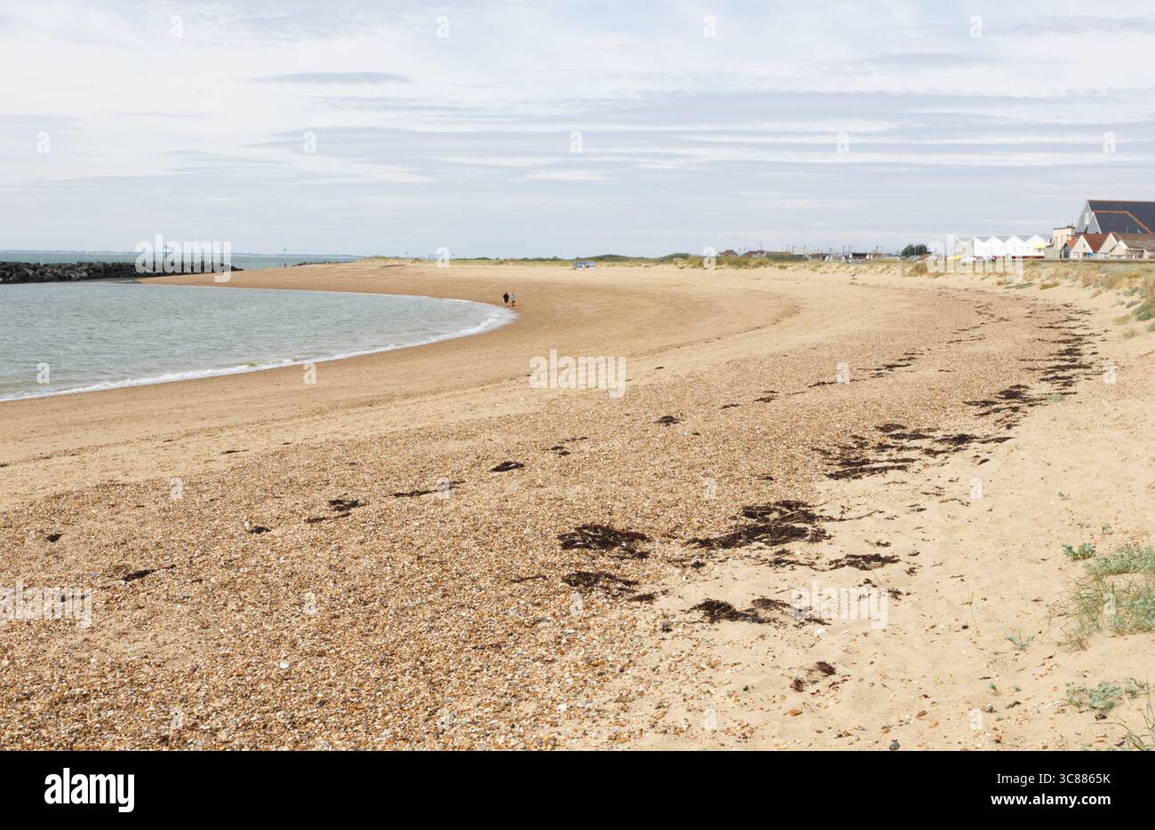 Beach at Jaywick sands in Essex. The Sunspot building along with houses ...
