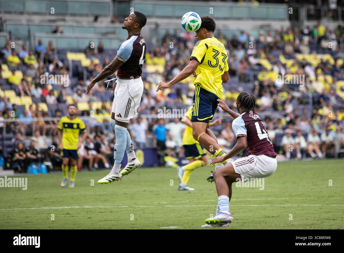 Nashville SC defender Chris Applewhite (33) heads the ball during the ...
