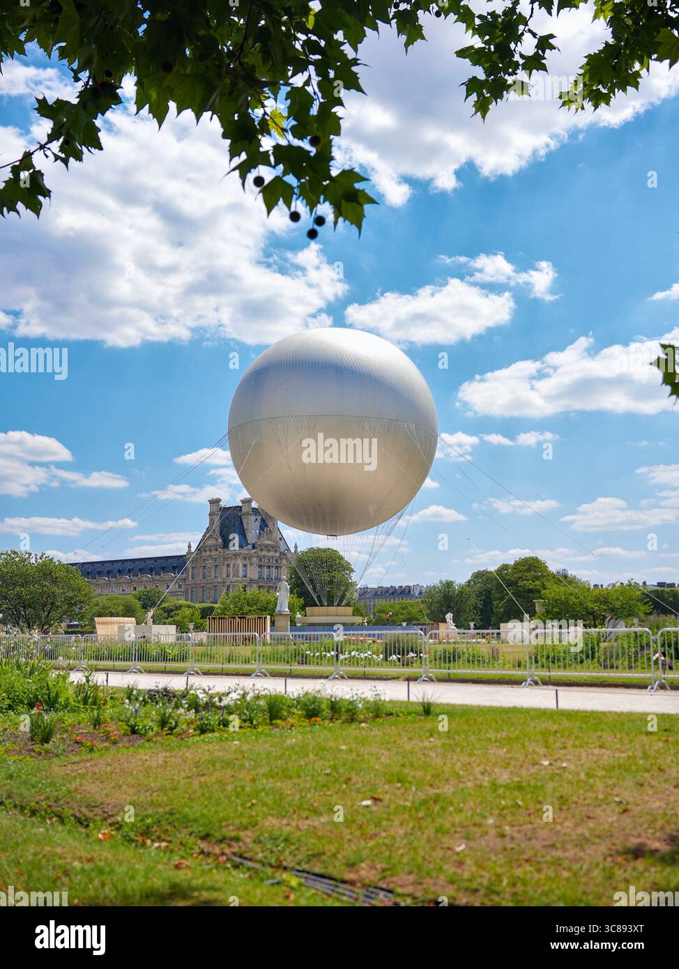 Paris France 2025 Paris Cauldron balloon rising over Jardin des ...