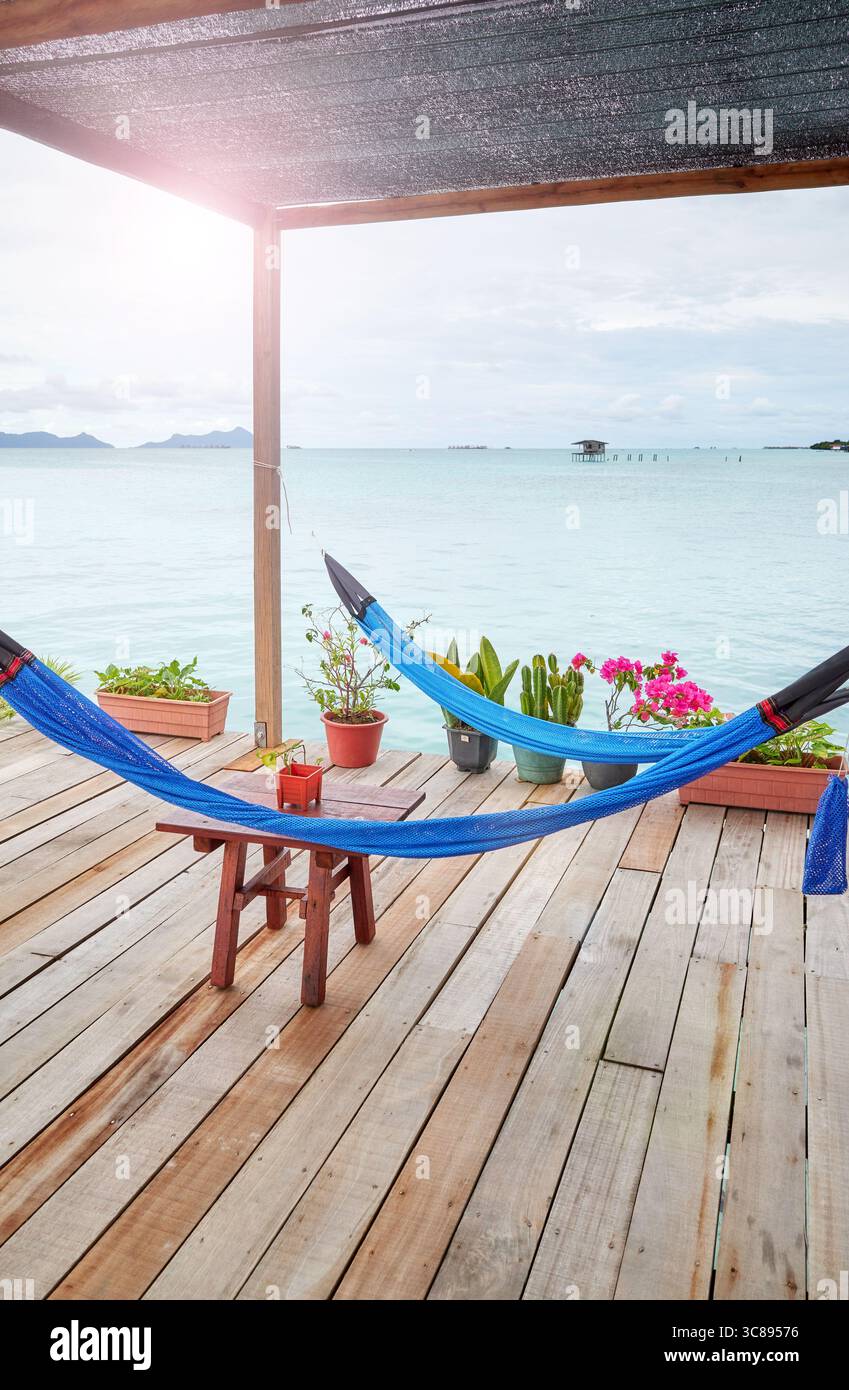 Wooden hammocks over sea hi-res stock photography and images - Alamy