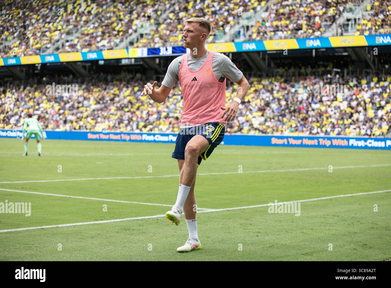 Nashville SC forward Sam Surridge (9) warms up on the sidelines during ...