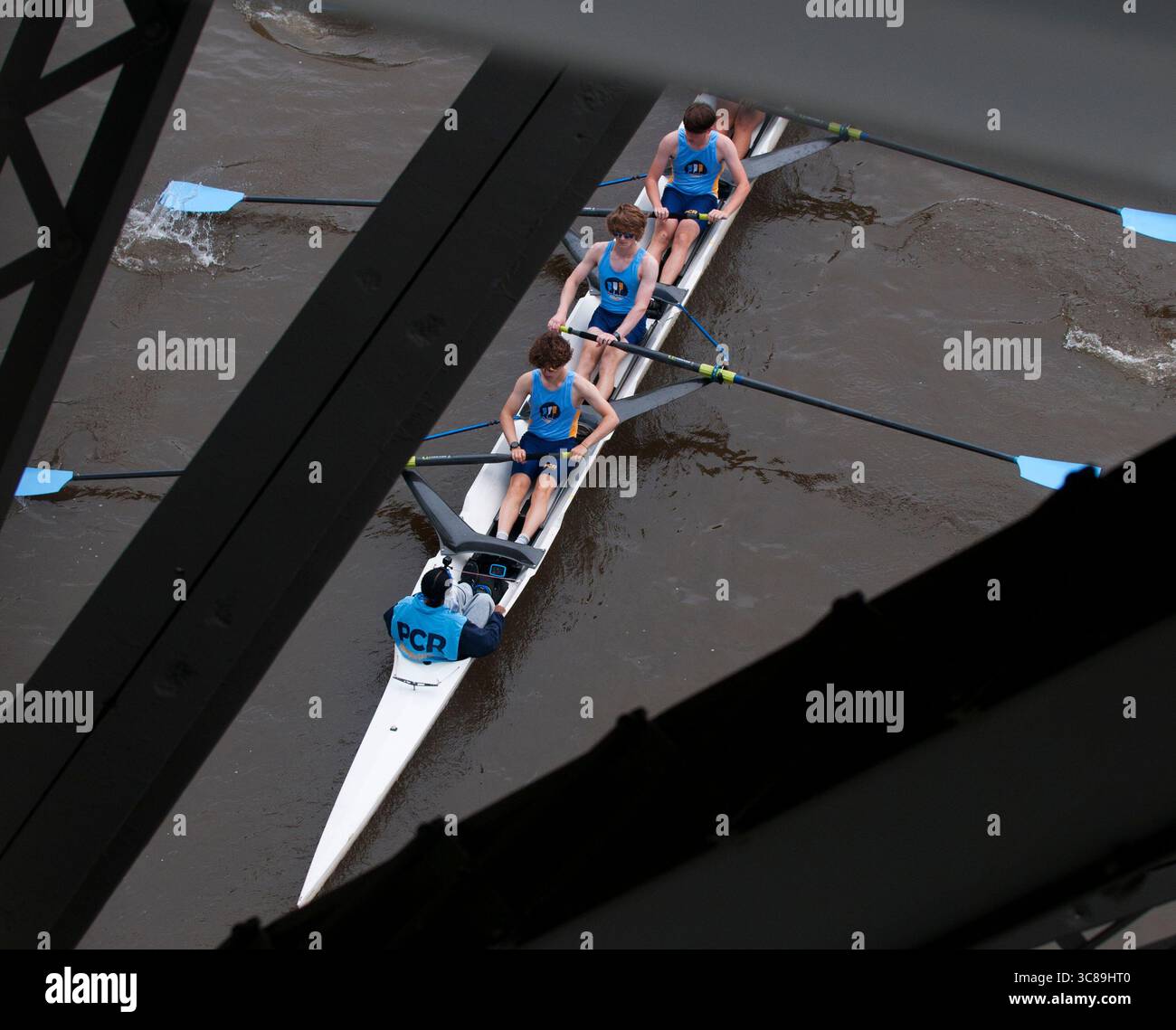 A crew team is framed by the superstructure of the Strawberry Mansion ...