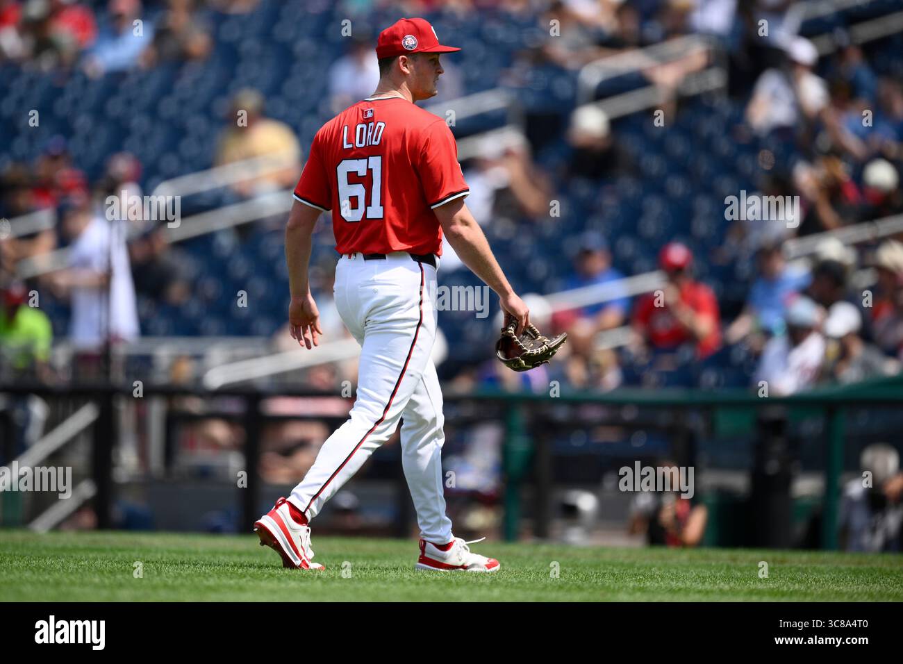 Washington Nationals starting pitcher Brad Lord walks back to the ...