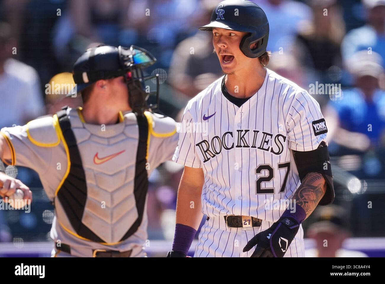 Colorado Rockies' Jordan Beck, front, reacts after being called out on ...