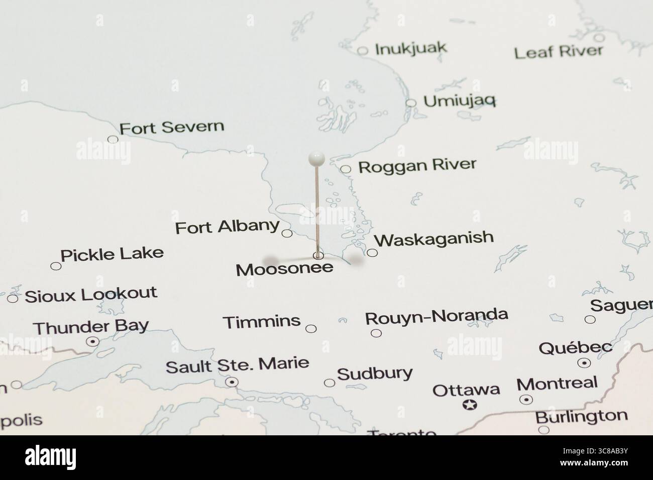 macro photo of a white pin needle into Moosonee city of Canada ...