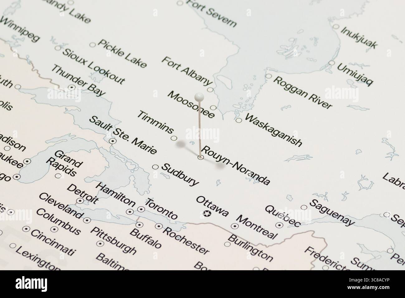 macro photo of a white pin needle into Rouyn Noranda city of Canada ...