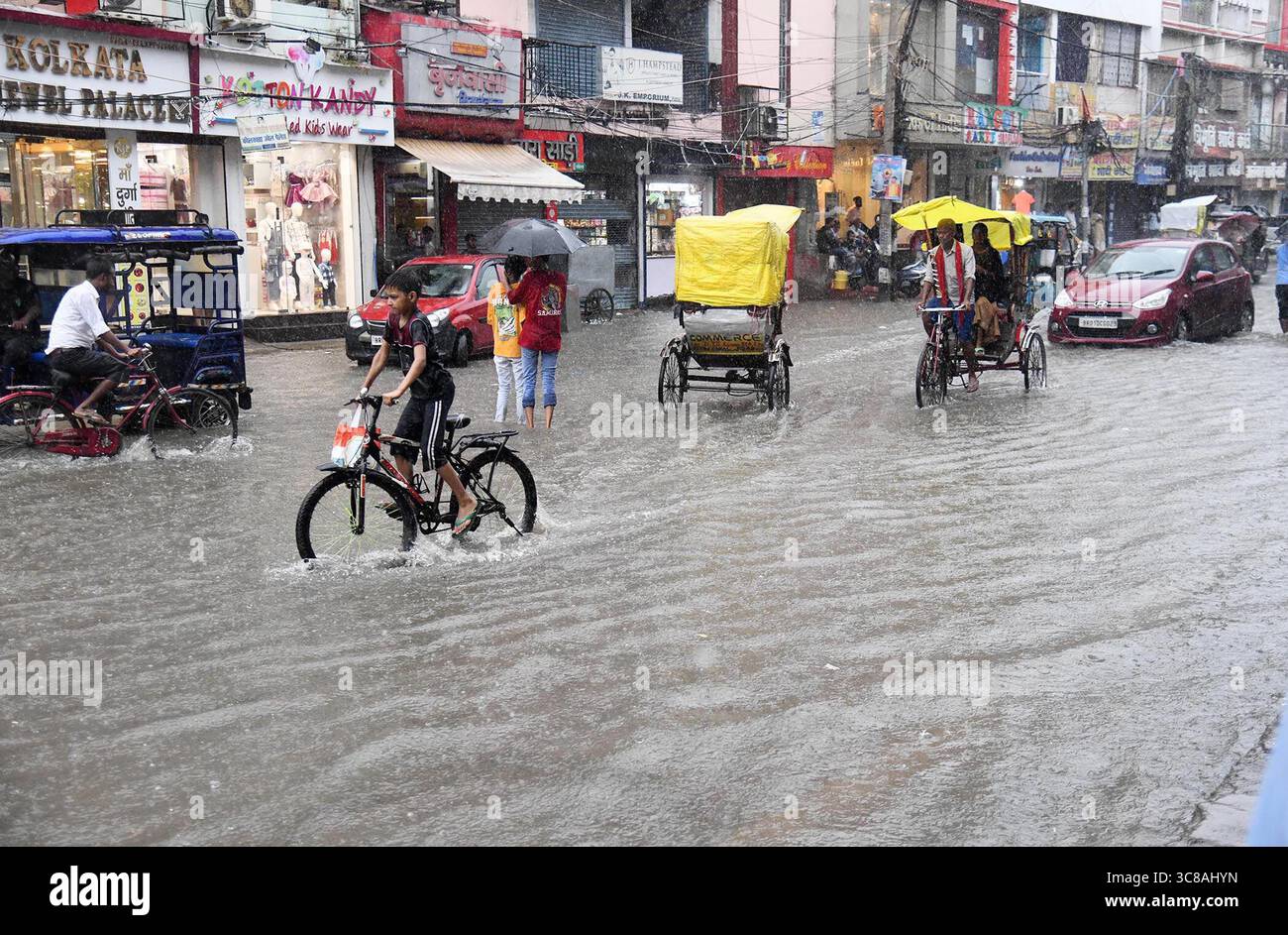 PATNA, INDIA - AUGUST 3: Vehicles crossing in waterlogged rain water ...
