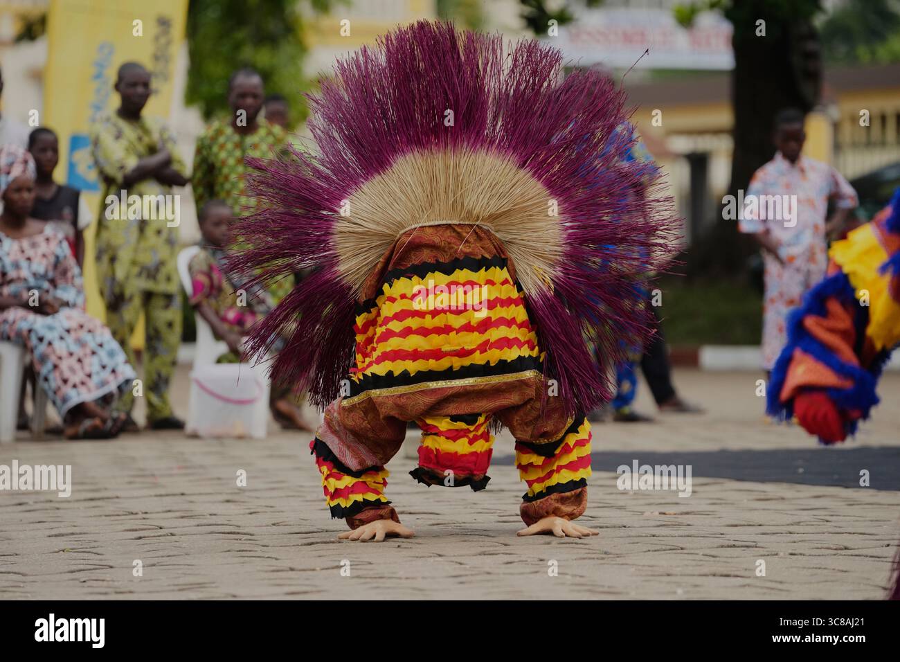 A man dress in a costume performs during the mask festival in Porto ...