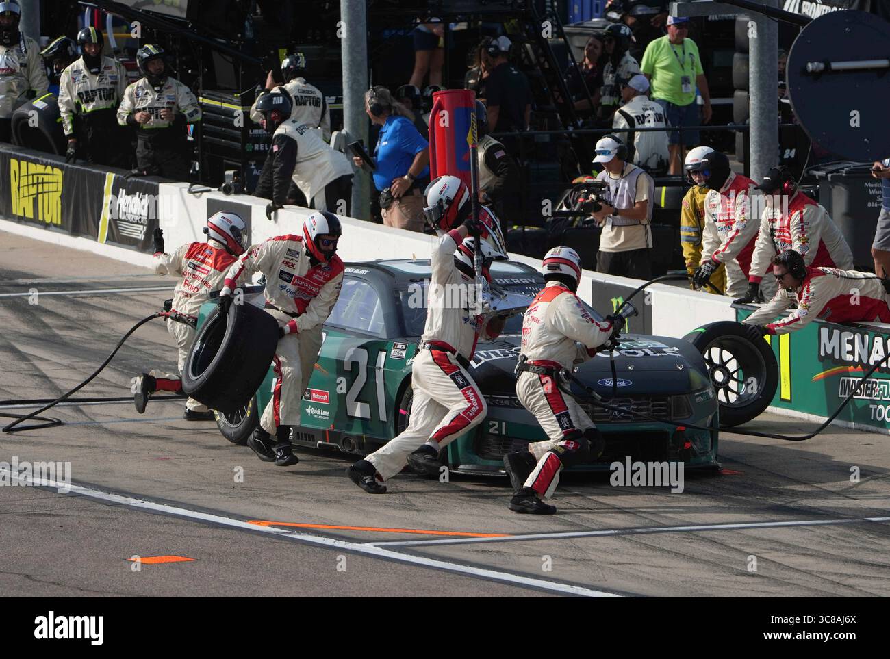 Pit crew members tend to the car of Josh Berry during a NASCAR Cup ...