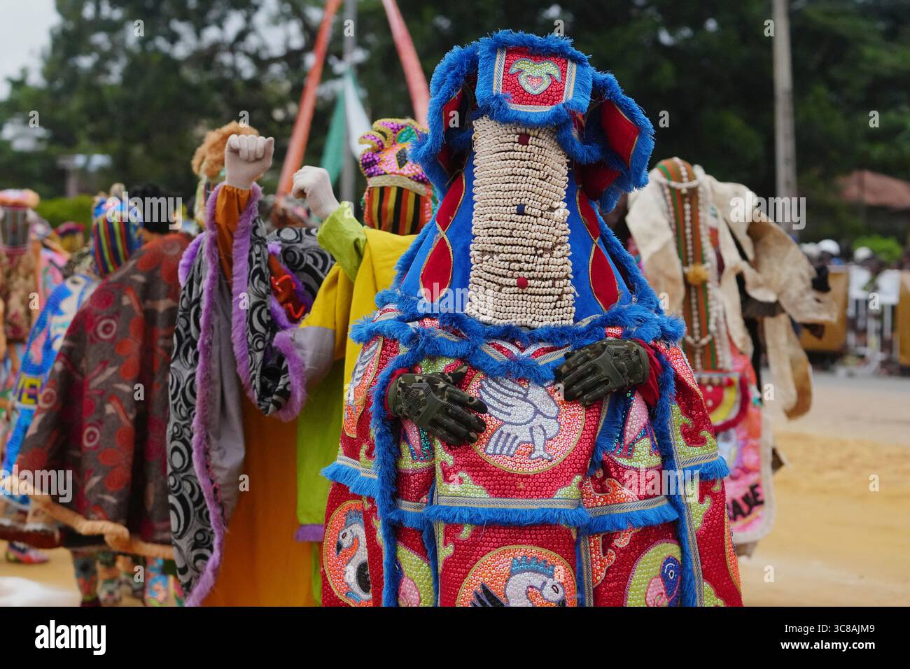 People dressed in costumes perform during the mask festival in Porto ...
