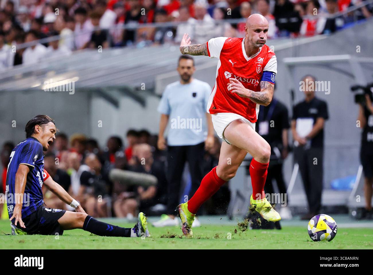 (L-R) Takashi Usami (Gamba), Nicolas Pallois (Reims), AUGUST 2, 2025 ...