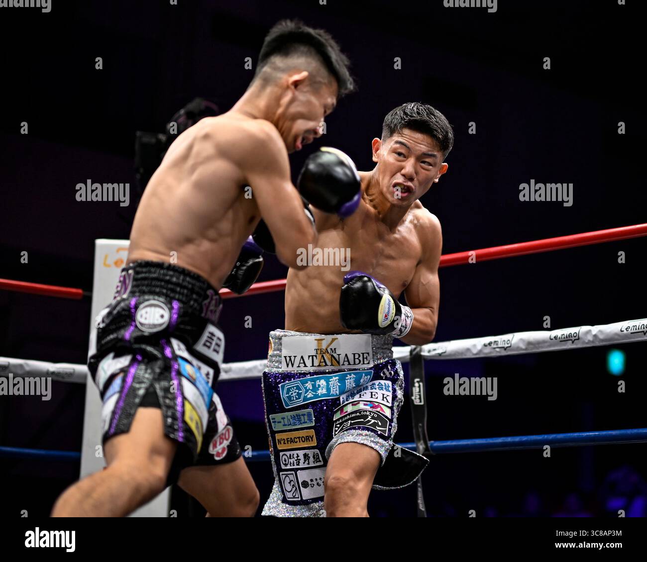Champion Kai Watanabe (R) and challenger Reo Saito compete during their ...