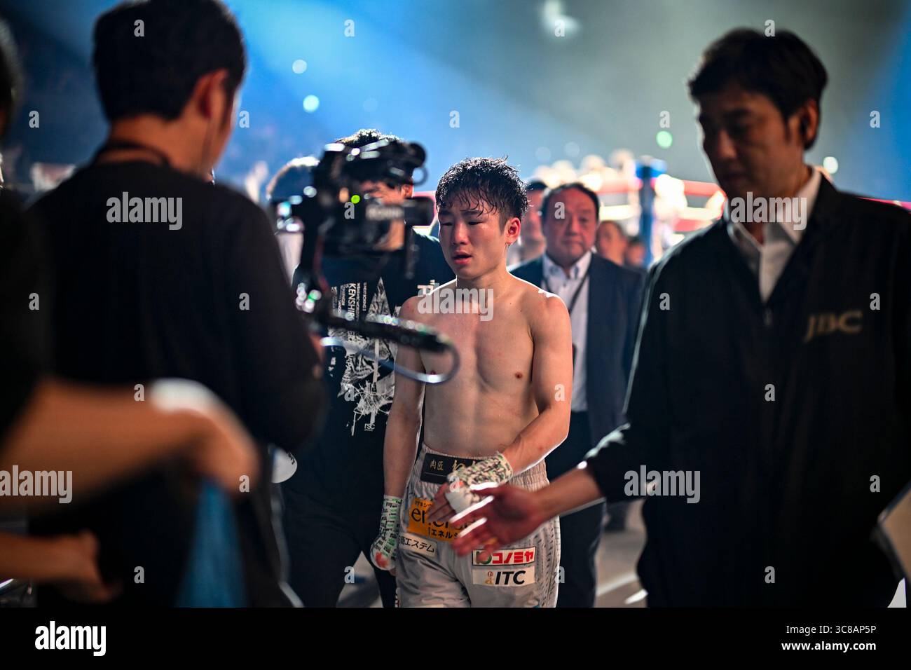Japan's Kenshiro Teraji looks dejected as he leaves the ring after ...