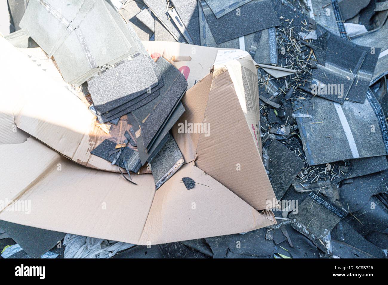 Roofing shingles damaged by hailstorm in garbage bin Stock Photo - Alamy