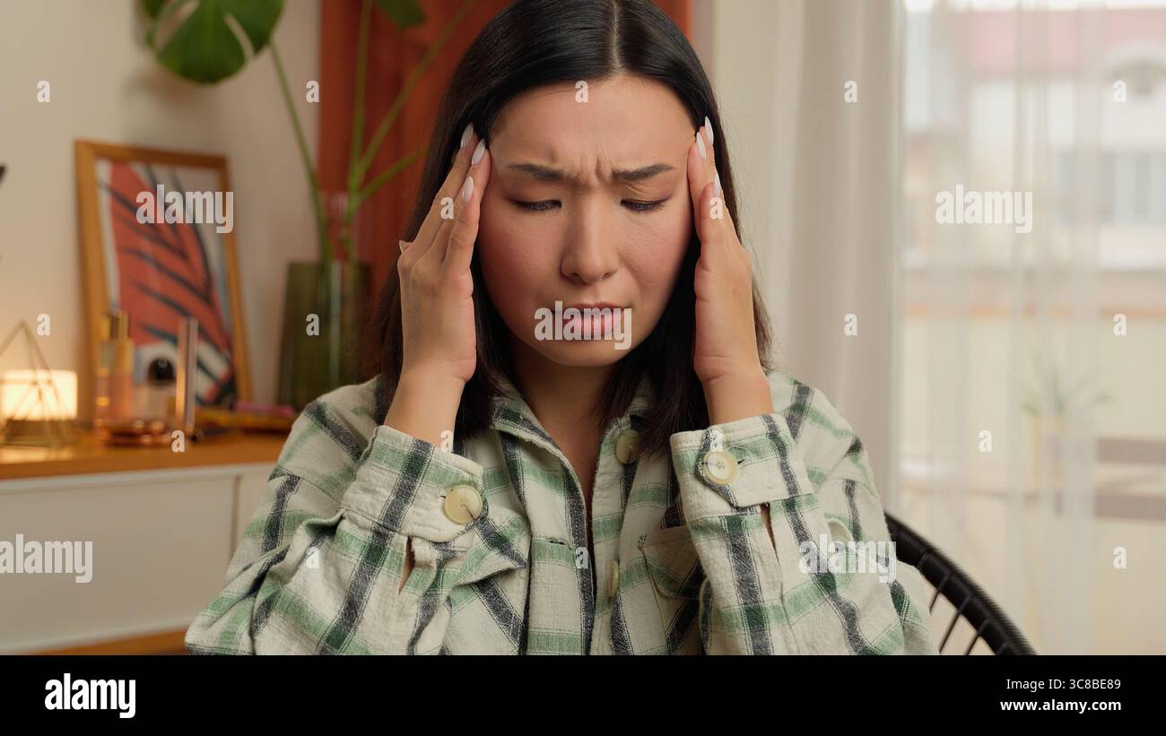 Asian Korean Chinese Japanese woman massage temples head headache ...