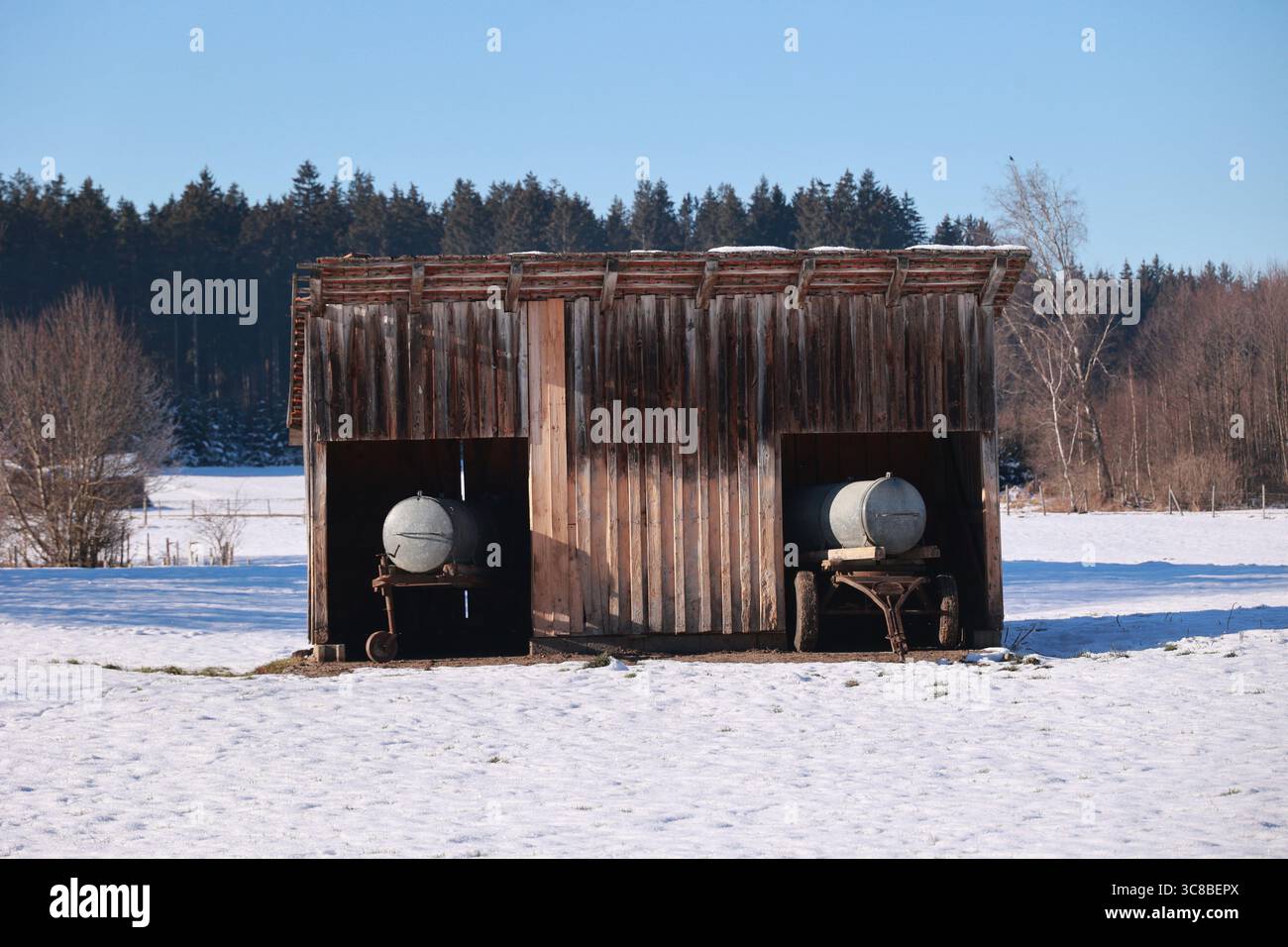 Small, old building with two tanks in it Stock Photo - Alamy