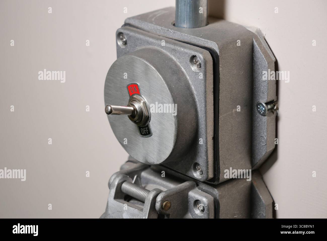 Electrical switch mounted on a metal wall box Stock Photo - Alamy