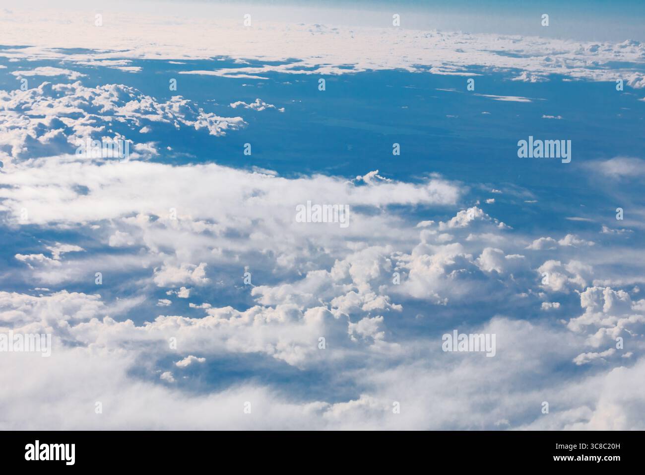 Aerial view of layered clouds stretching across the horizon, soft and ...