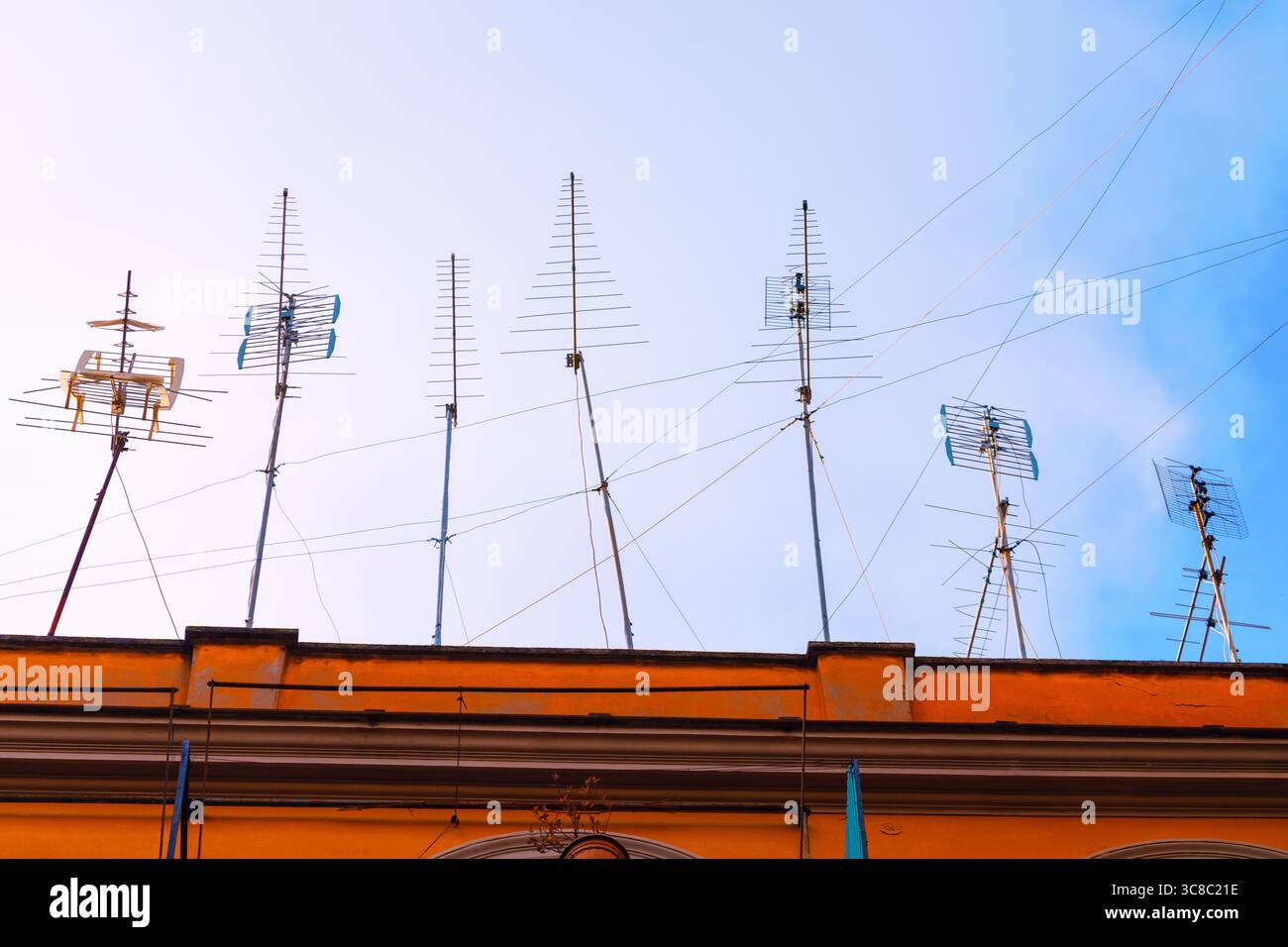 Vintage television antennas on the rooftop. Multiple antennas, a visual ...