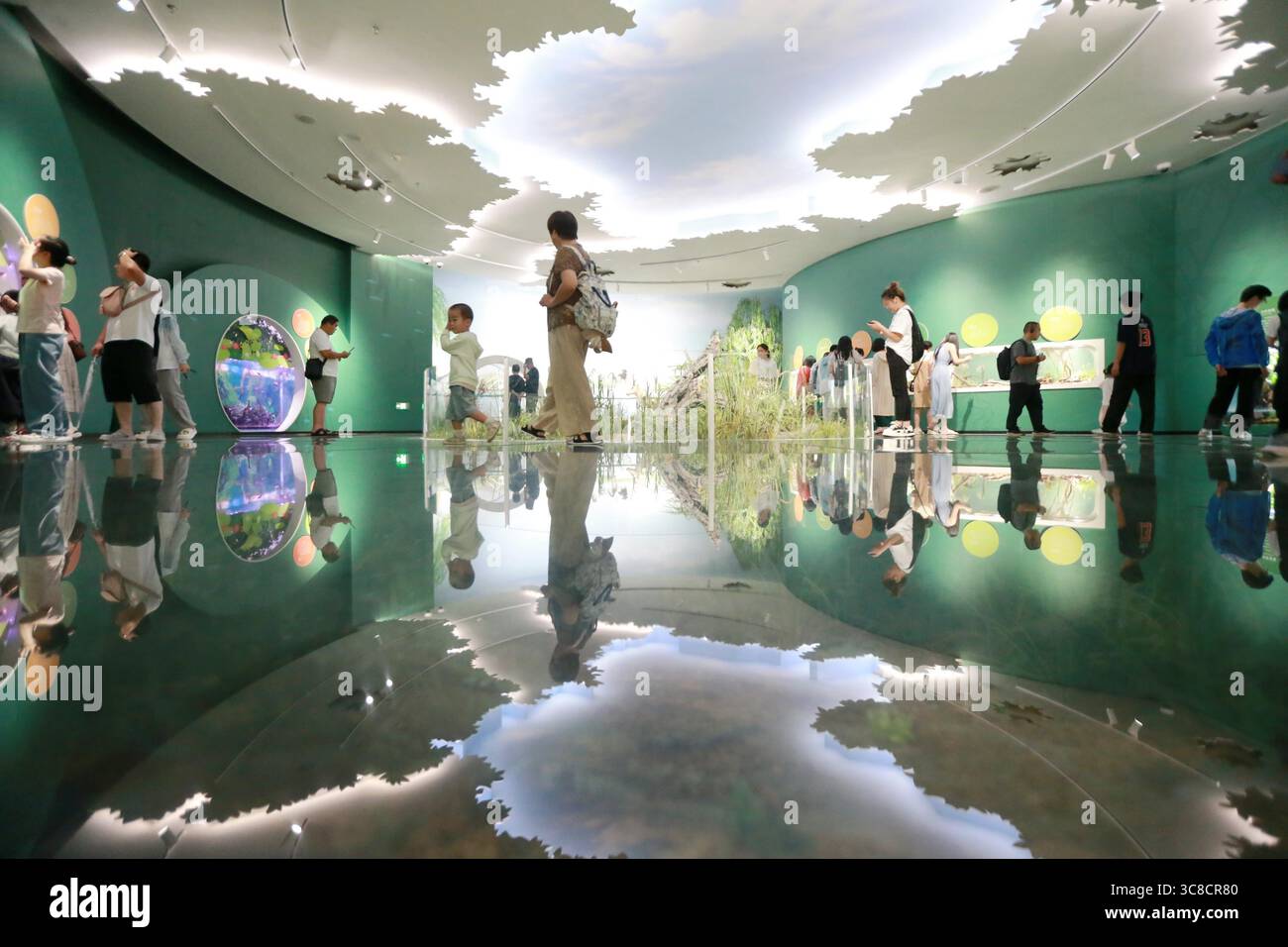 Parents take their children to visit the China Grand Canal Museum in ...