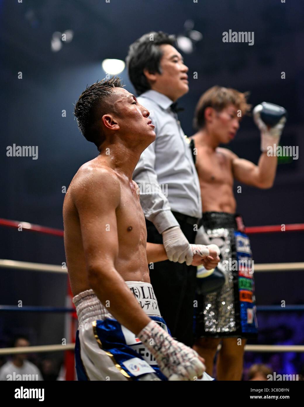 Challenger Shigetoshi Kotari looks dejected as champoin Yamato Hata ...