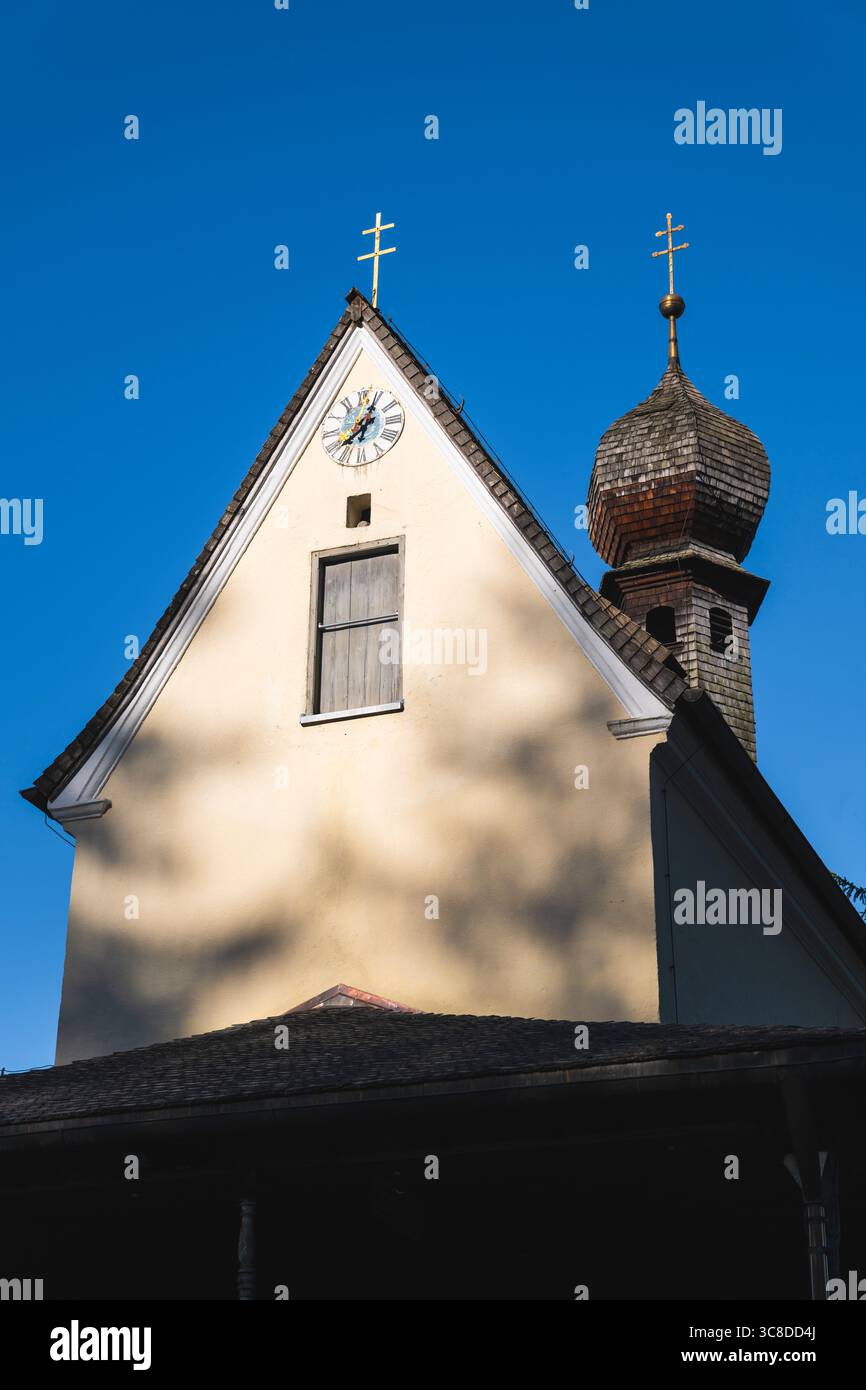 First morning sun on the gable with clock and steeple of the pilgrimage ...