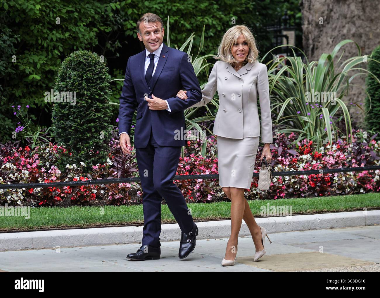 President of France Emmanuel Macron and wife Brigitte walk up Downing ...