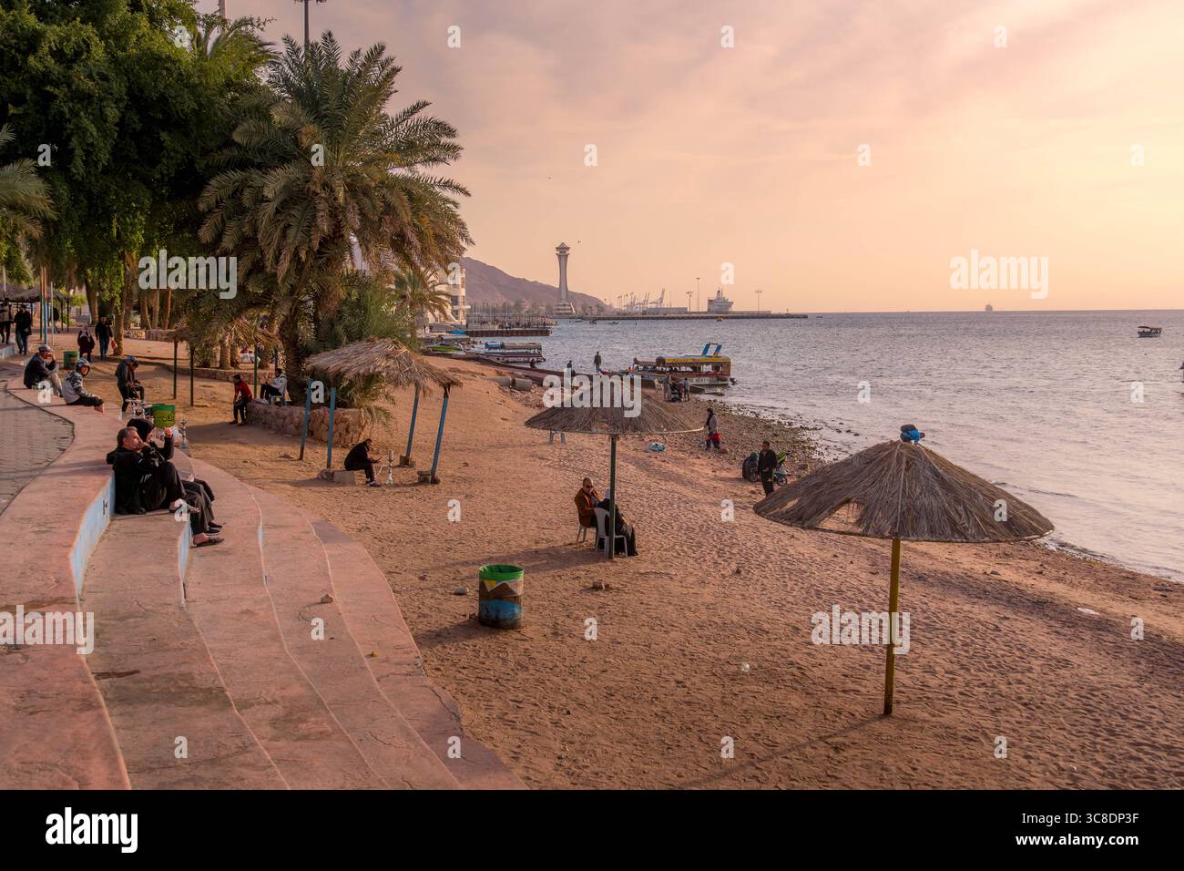 Aqaba beach showcasing the waterfront promenade with local people and ...