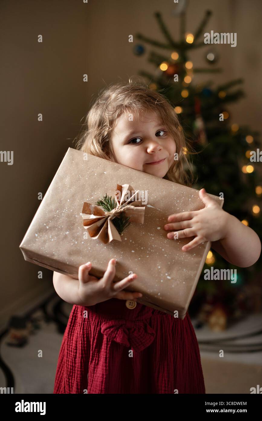 Festive child holding christmas hi-res stock photography and images - Alamy