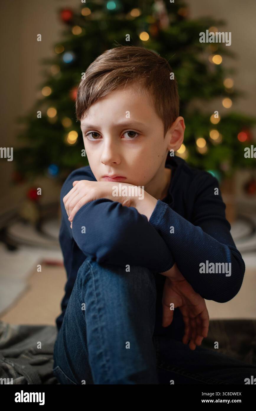 Family sitting near christmas tree hi-res stock photography and images ...