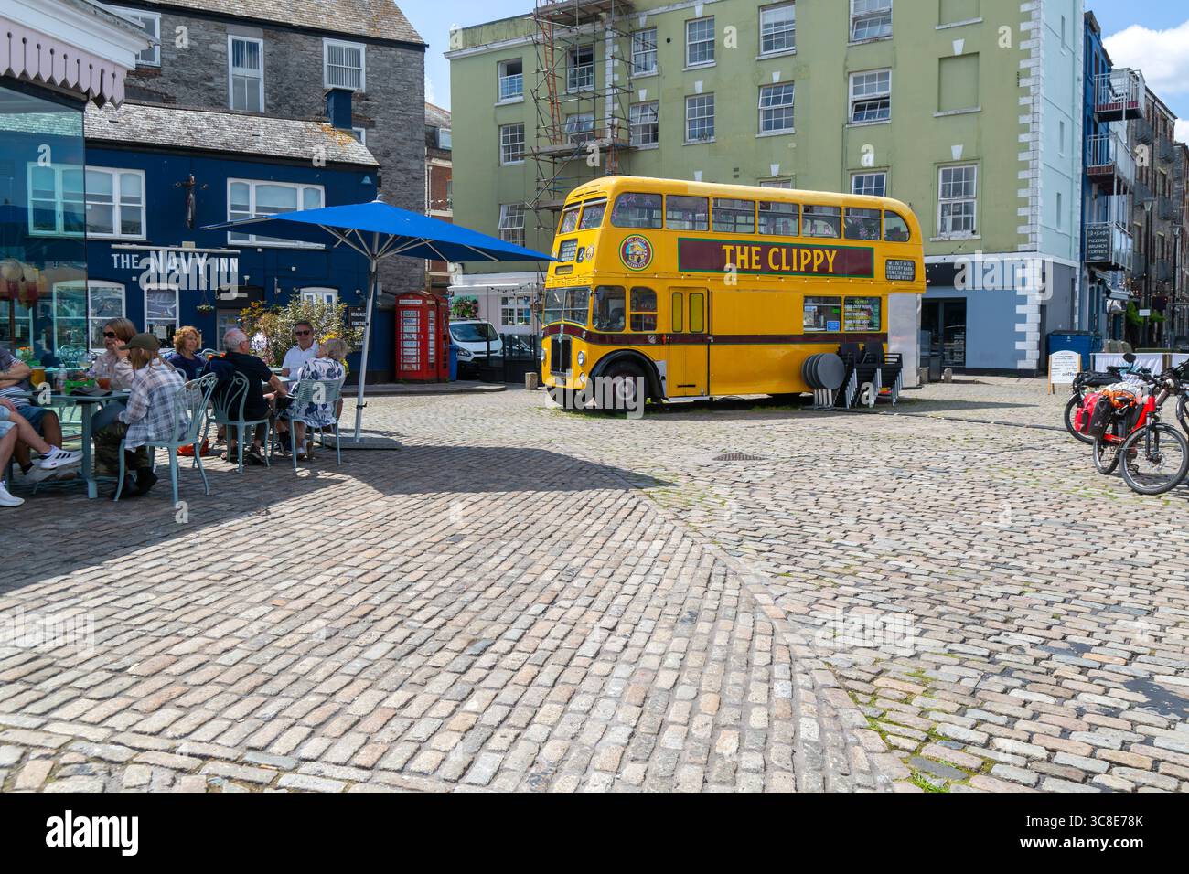 The Clippy yellow double-decker bus, The Barbican, Plymouth, Devon ...