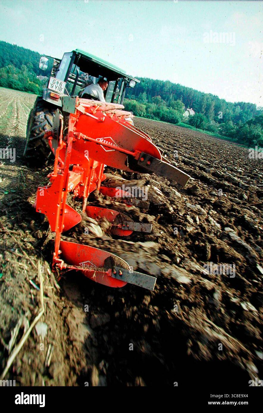 Soil cultivation and farming with a tractor in the field Soil ...